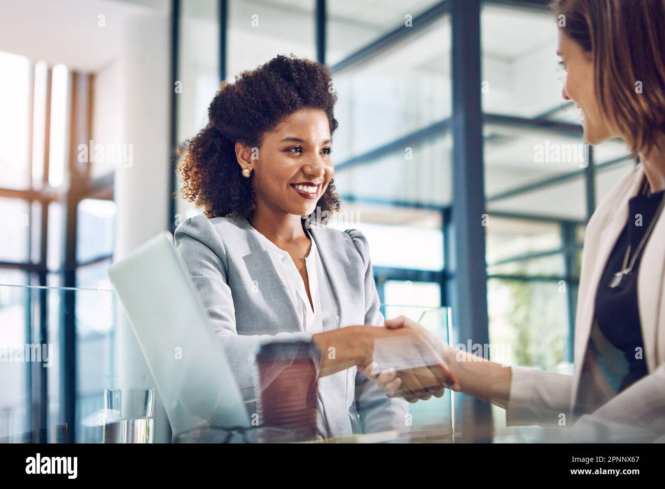 Team players who work together win together. two young businesswomen ...