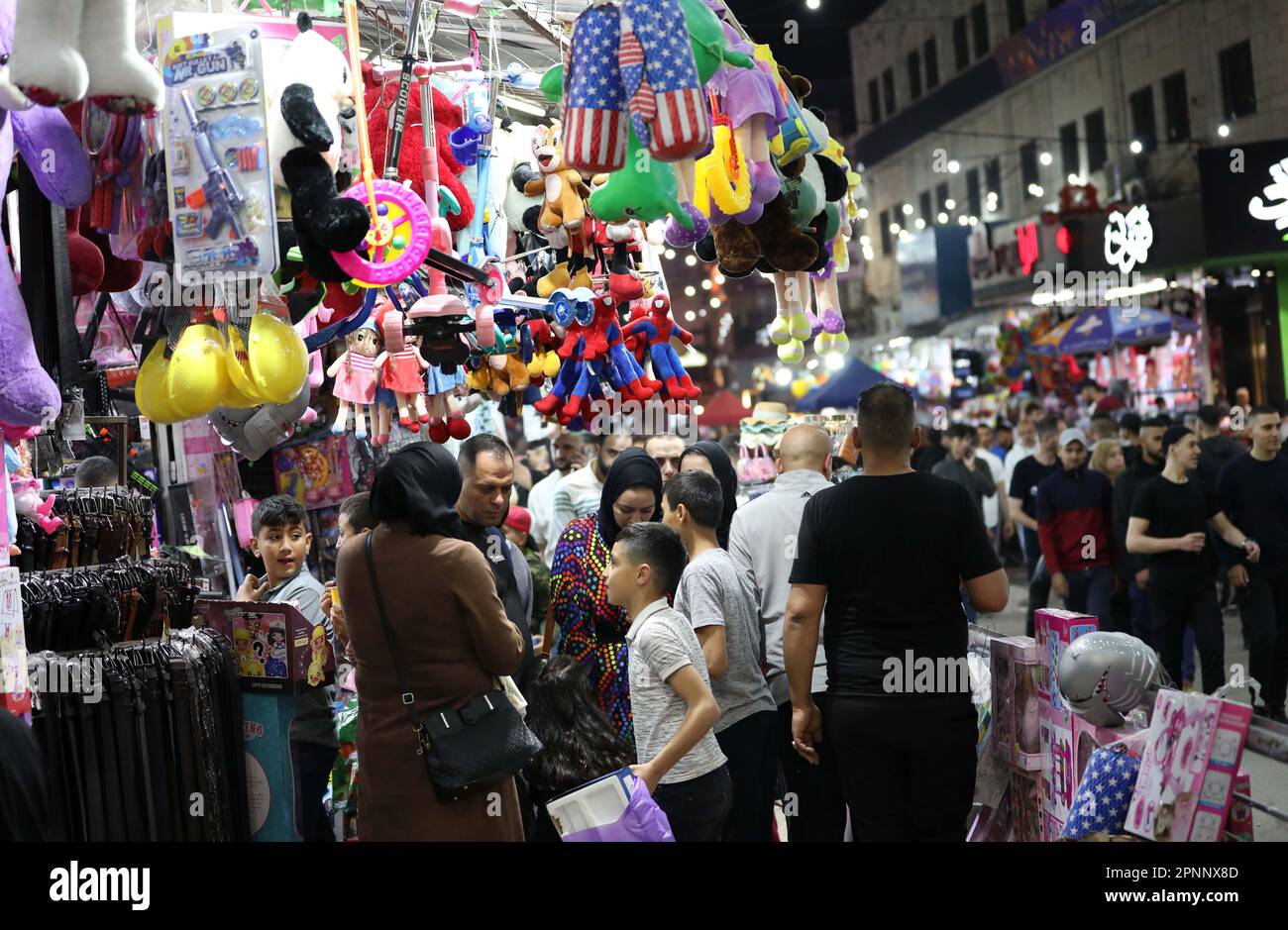Nablus. 19th Apr, 2023. People shop at a market ahead of the Eid al ...