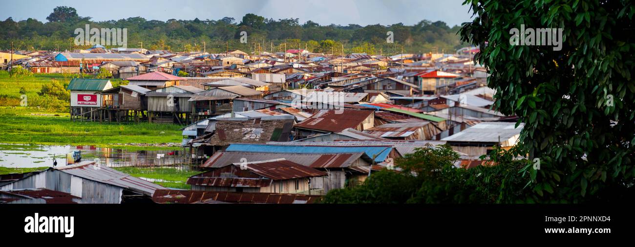 Iquitos, Peru - Apr, 2022: Floating shantytown of Belén, consisting of scores of huts, built on ...