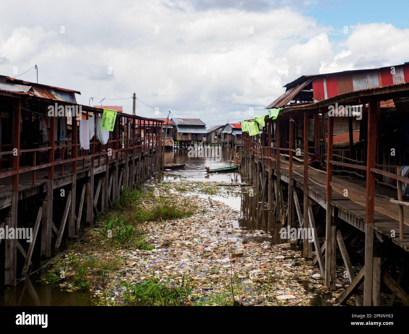 Iquitos, Peru - Apr, 2022: Floating shantytown of Belén, consisting of scores of huts, built on ...