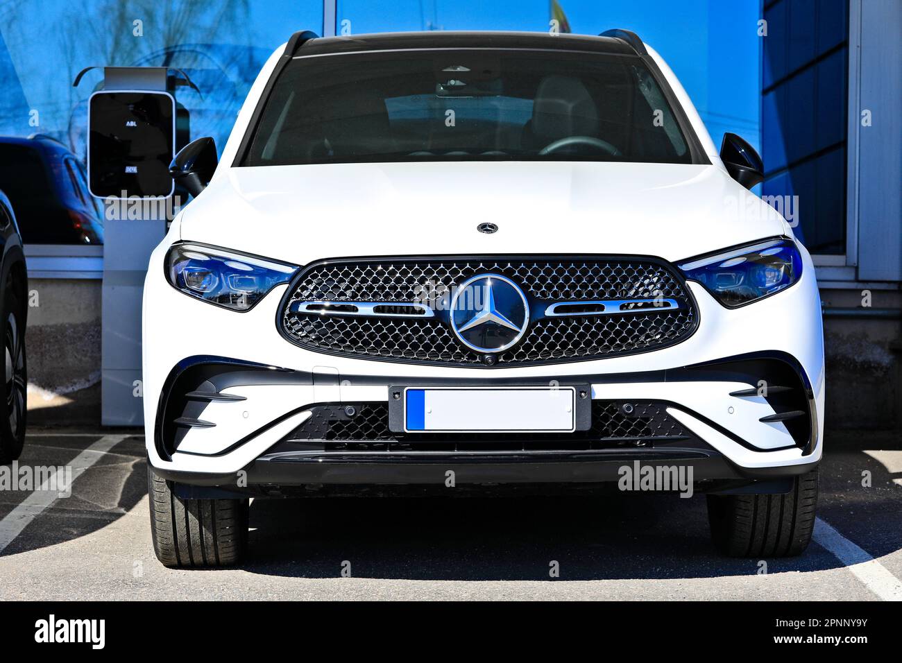 New white Mercedes-Benz 4matic luxury SUV car parked, DEFA charger for ...