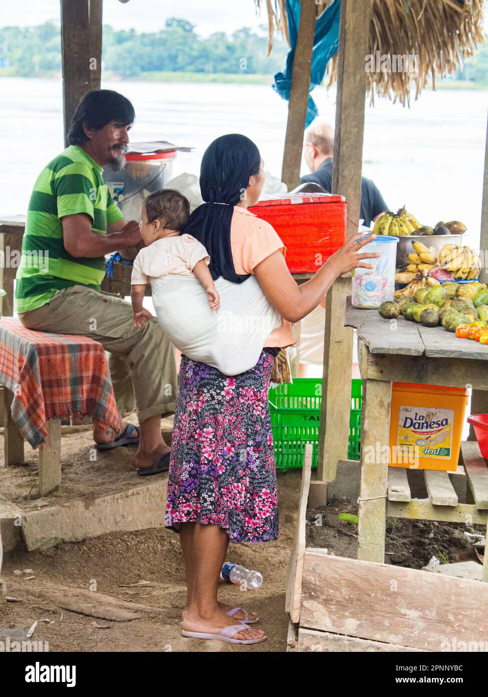 Amazonia, Peru - December 2017: A mother with a small child in a sling ...