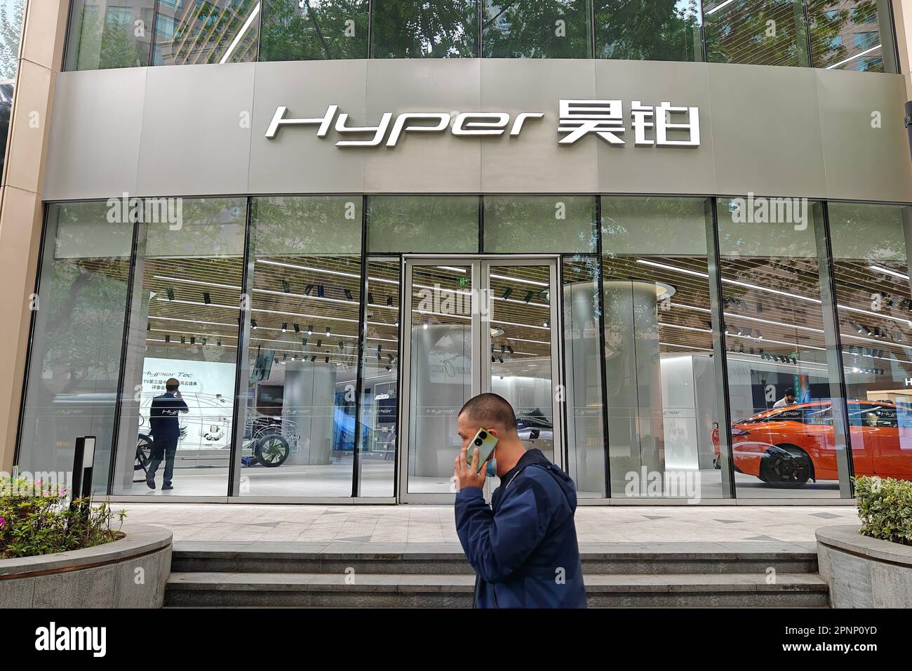 SHANGHAI, CHINA - APRIL 20, 2023 - Customers look at the Hyper GT model ...