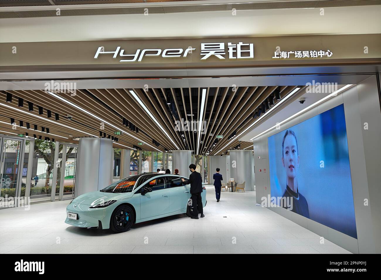 SHANGHAI, CHINA - APRIL 20, 2023 - Customers look at the Hyper GT model ...
