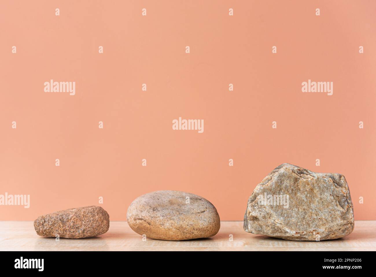 A row of three stones, arranged in size from smallest to largest, empty ...