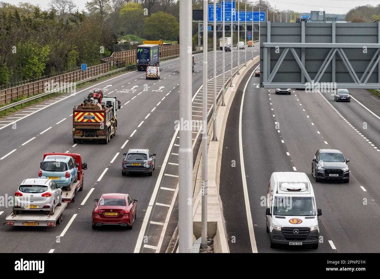 Slough, UK. 19th April, 2023. Vehicles pass along a recently completed ...