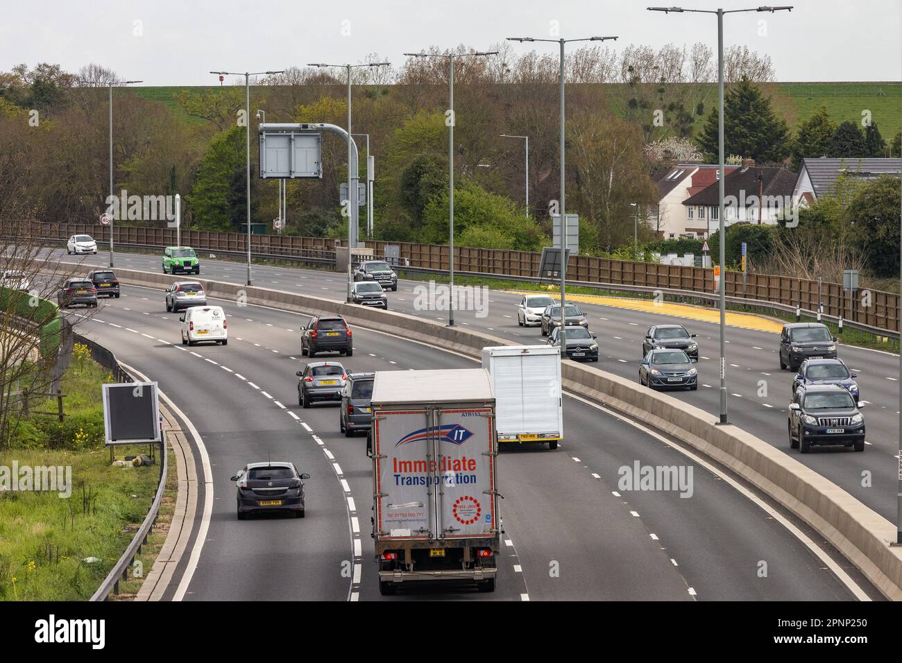 Slough, UK. 19th April, 2023. Vehicles pass along a recently completed ...