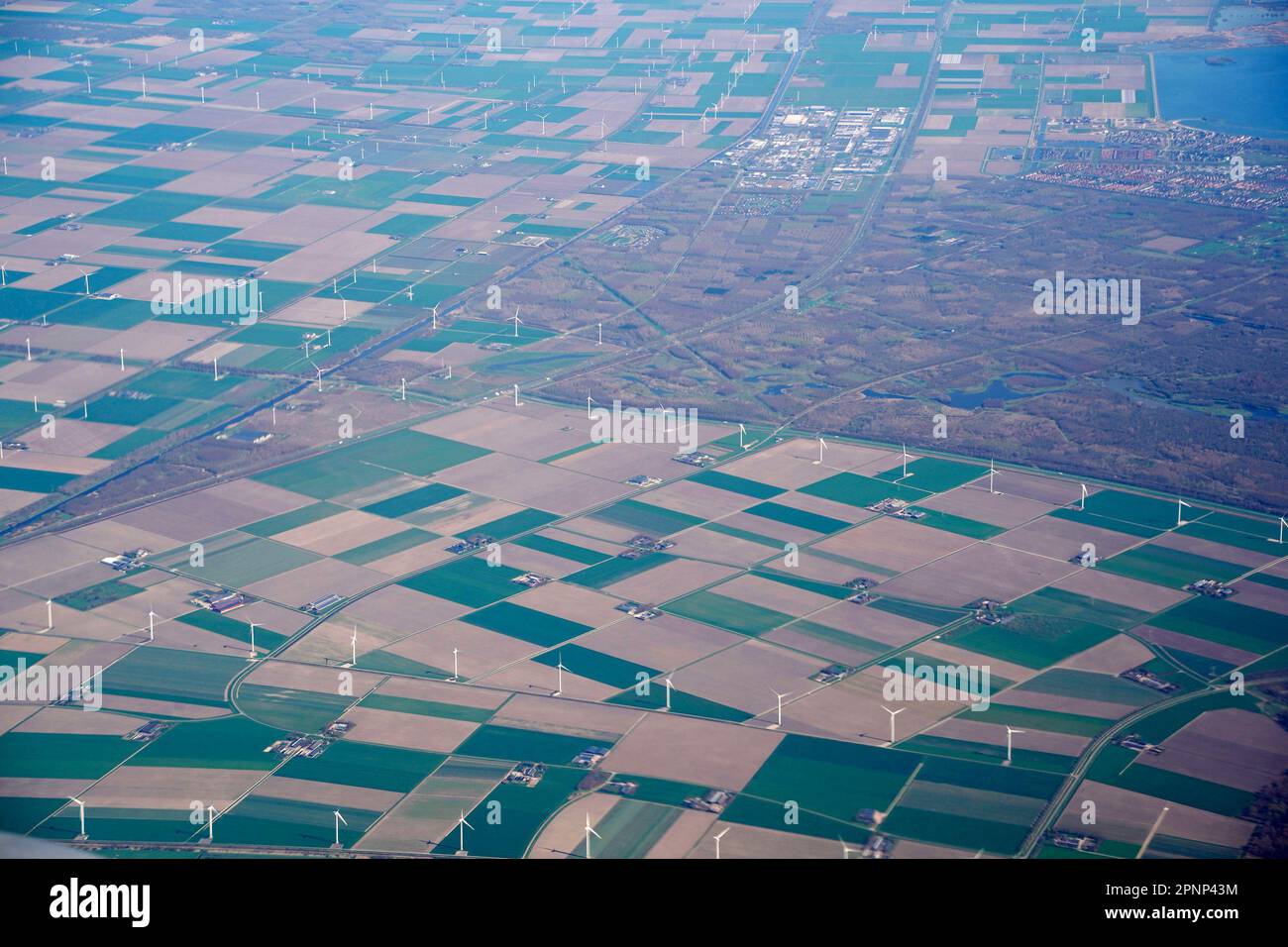 An aerial view of wind farm Multiple wind turbines generating eco ...