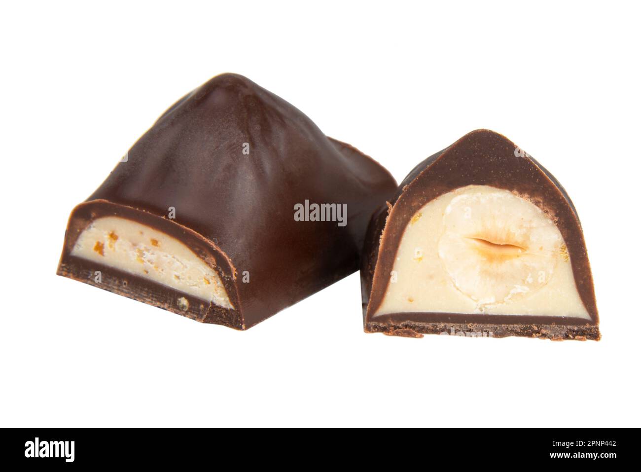 Chocolate sweet candy with nut glazed in half isolated on the white ...