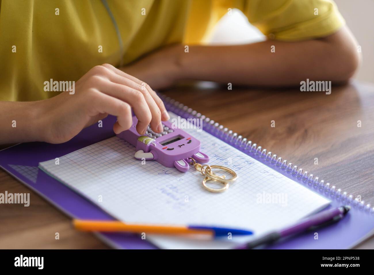 hands pupil close up, school girl going math homework at home ...