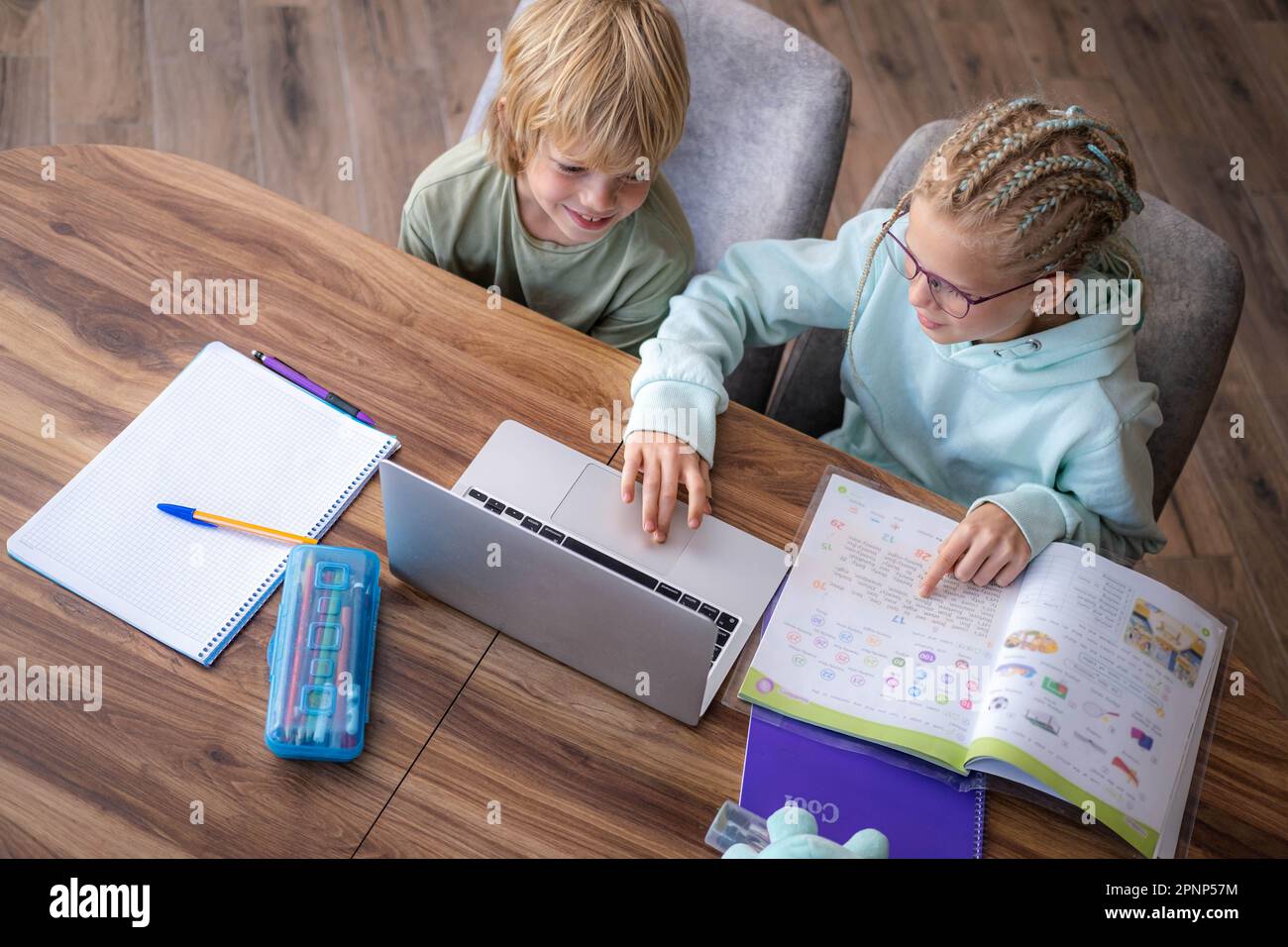 top view siblings pupils boy and girl learning together remotely online ...