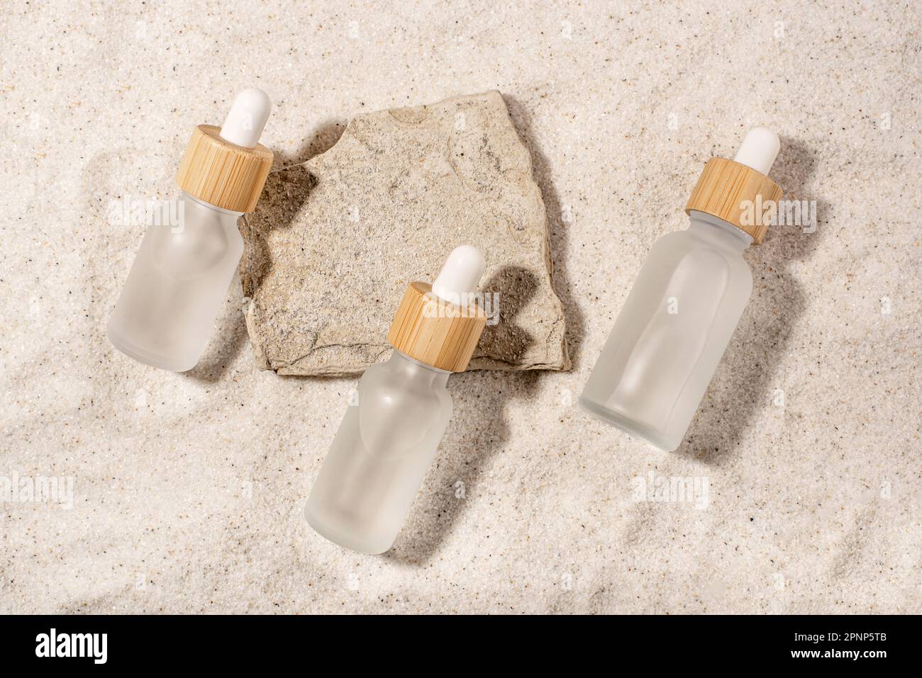 Glass bottles with a cosmetic product Stock Photo - Alamy