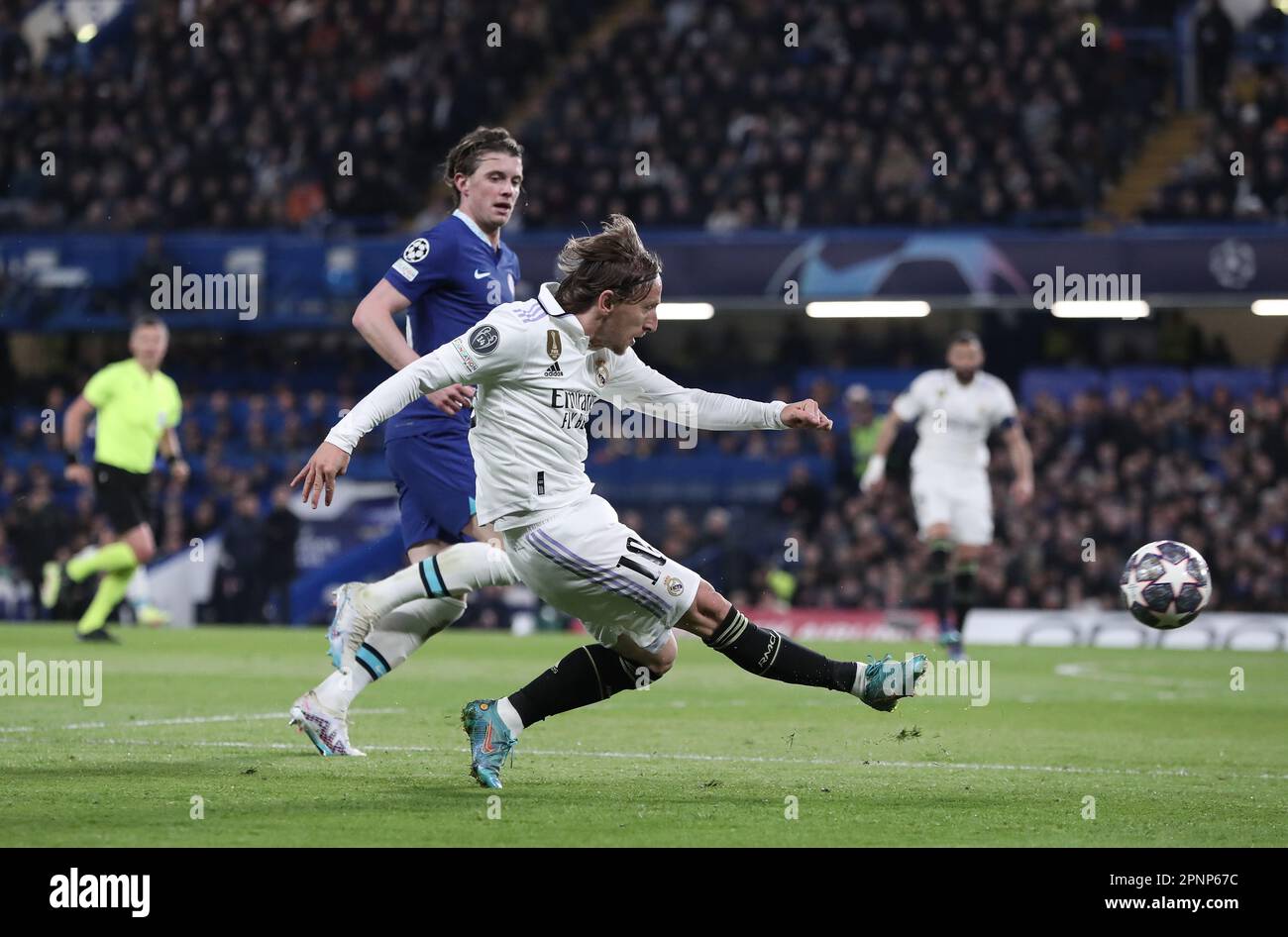 Luka Modric of Real Madrid has a shot despite the attentions Conor ...