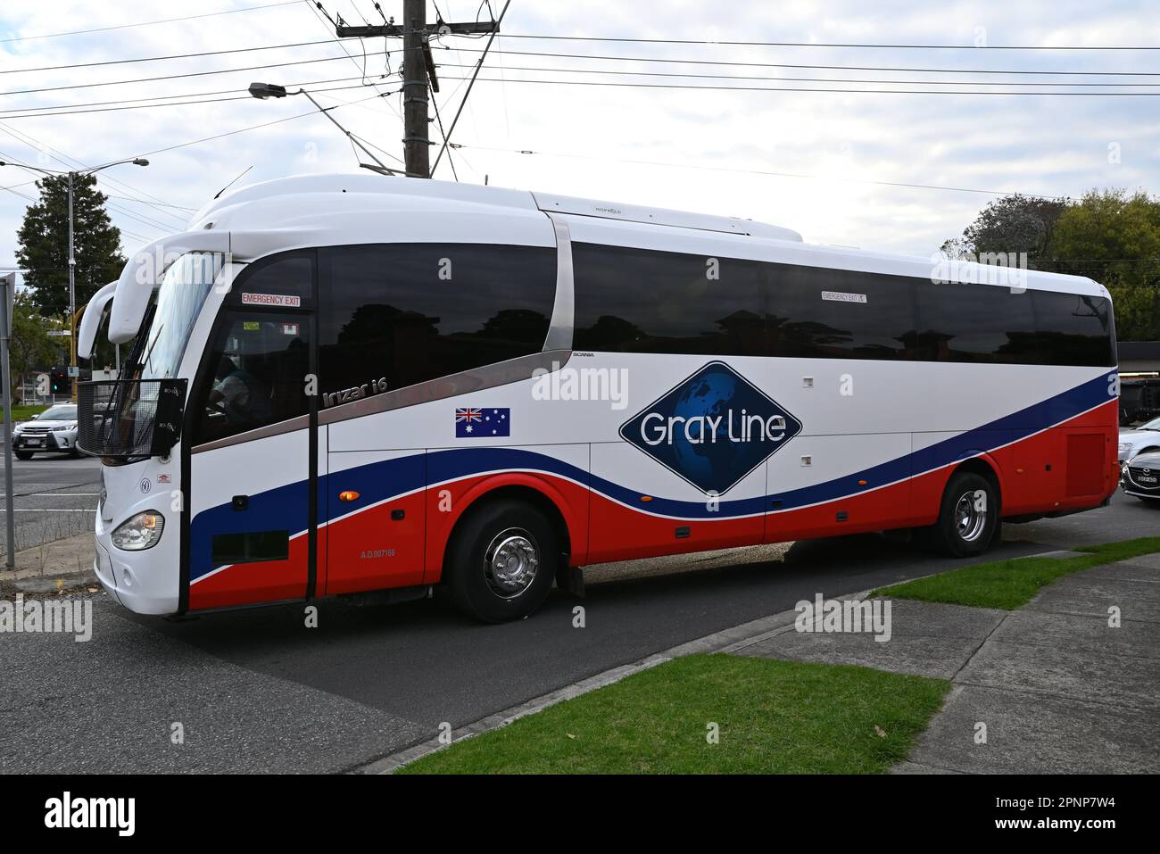 Gray Line coach, a white Irizar i6, preparing to turn at an ...