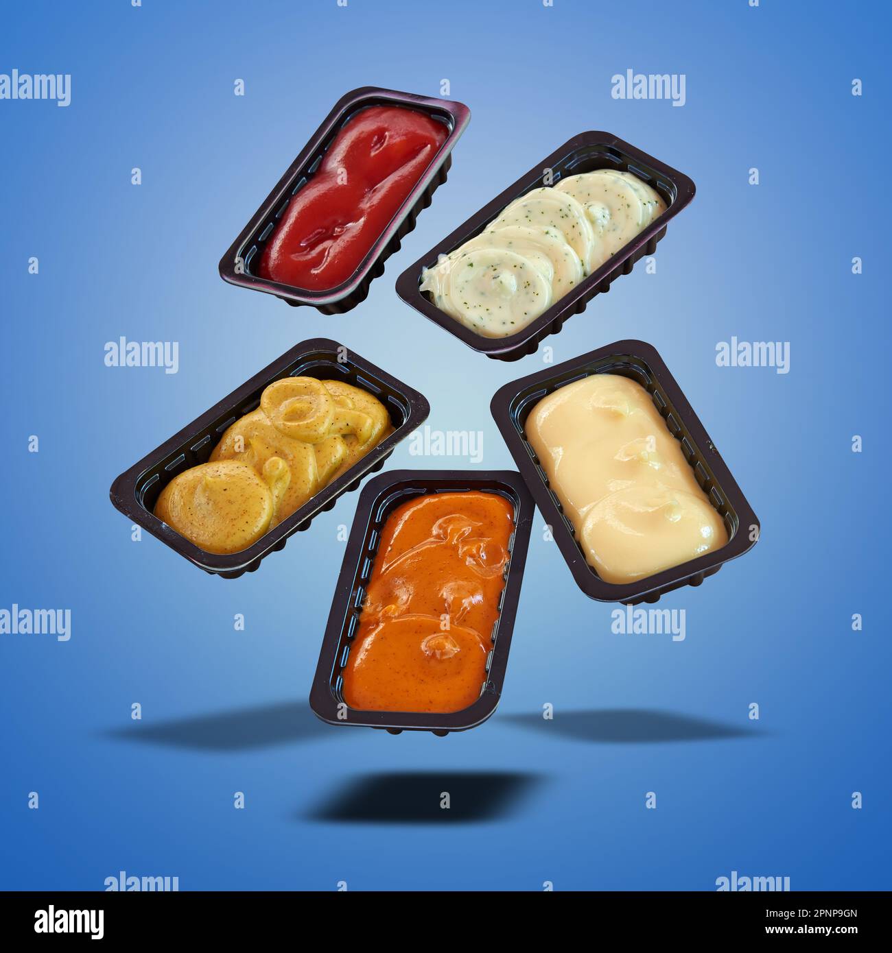 Floating Fast food different kind of sausages against blue radial ...