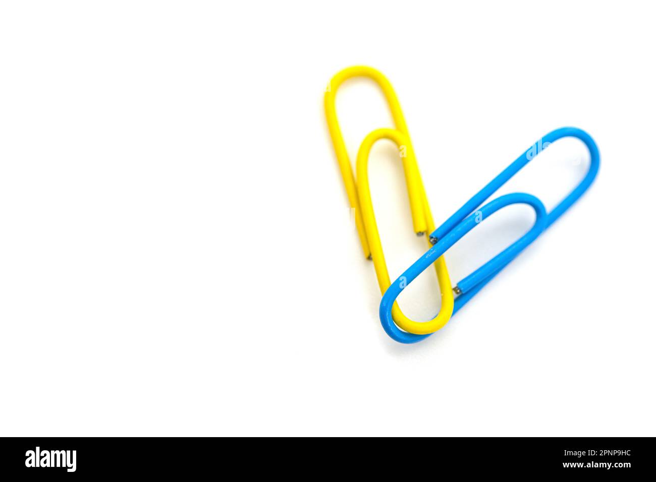 Heart of color paper clip isolated on white background Stock Photo - Alamy