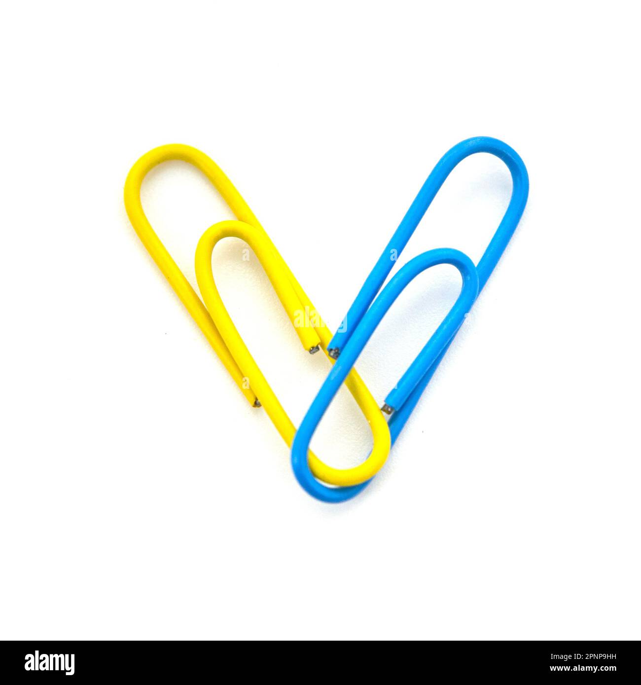Heart of color paper clip isolated on white background Stock Photo - Alamy