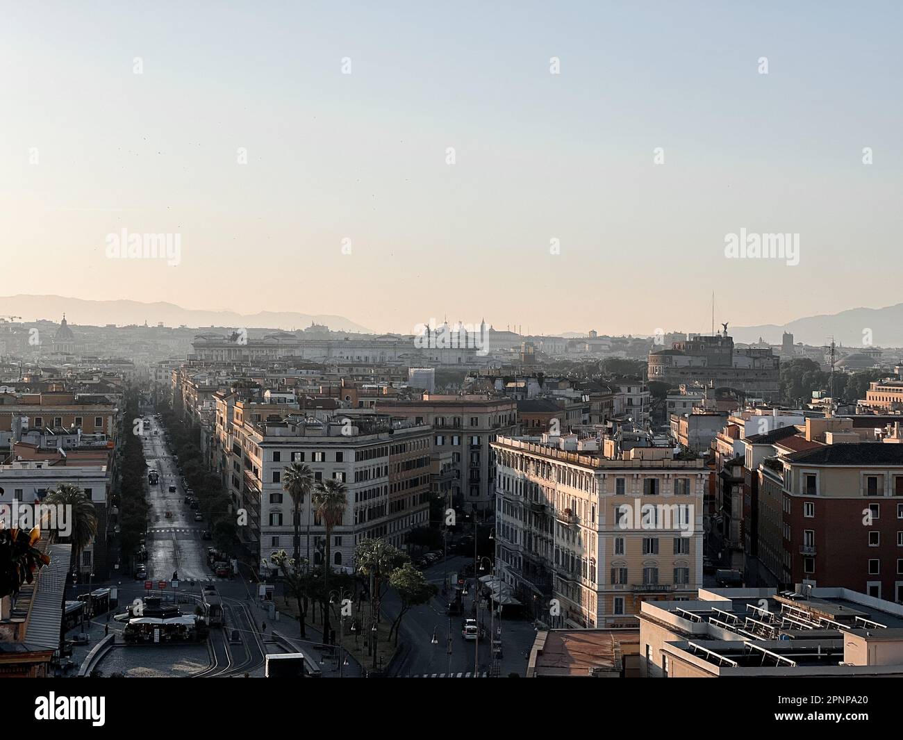 This stock photo shows a sprawling cityscape with large, modern ...