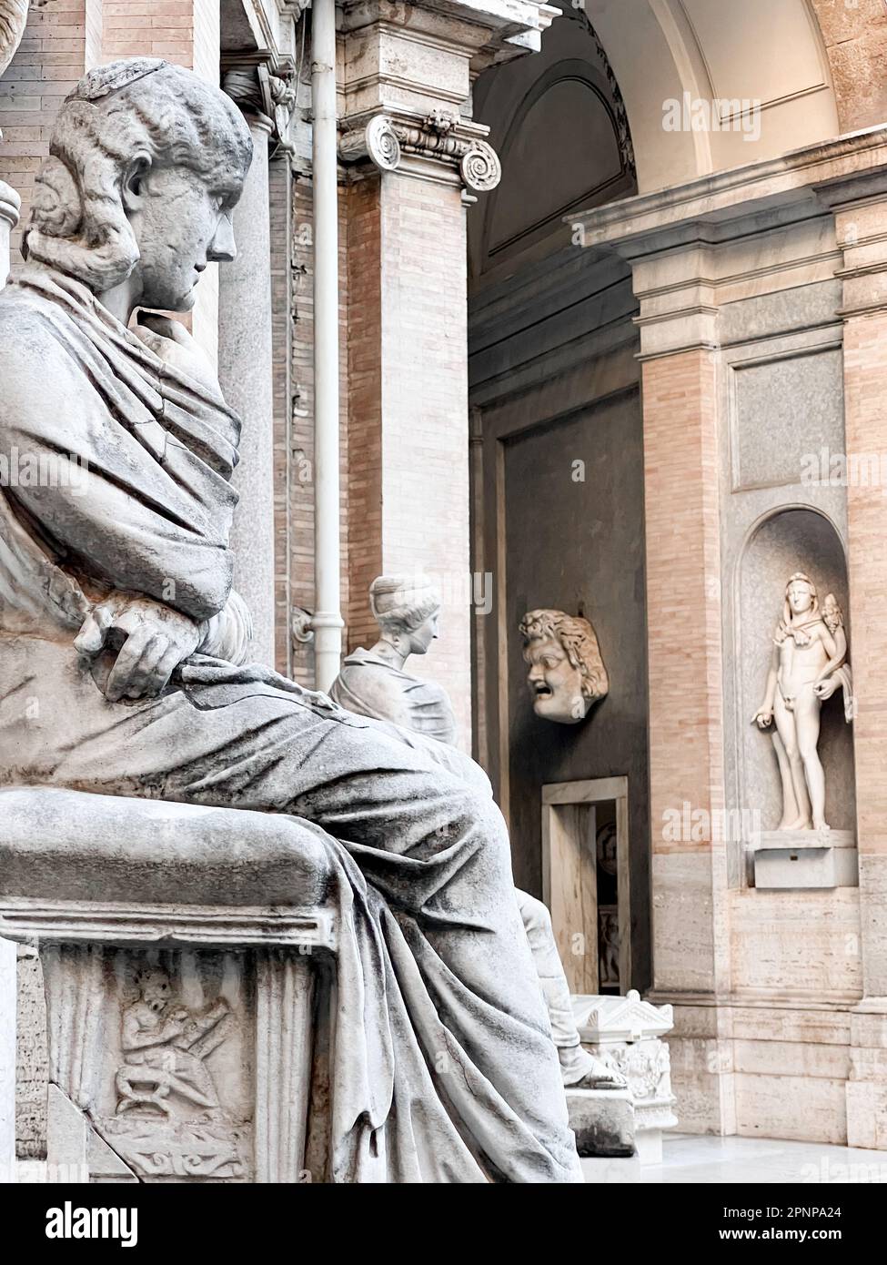 An elevated shot of two aged statues standing side-by-side in an ...