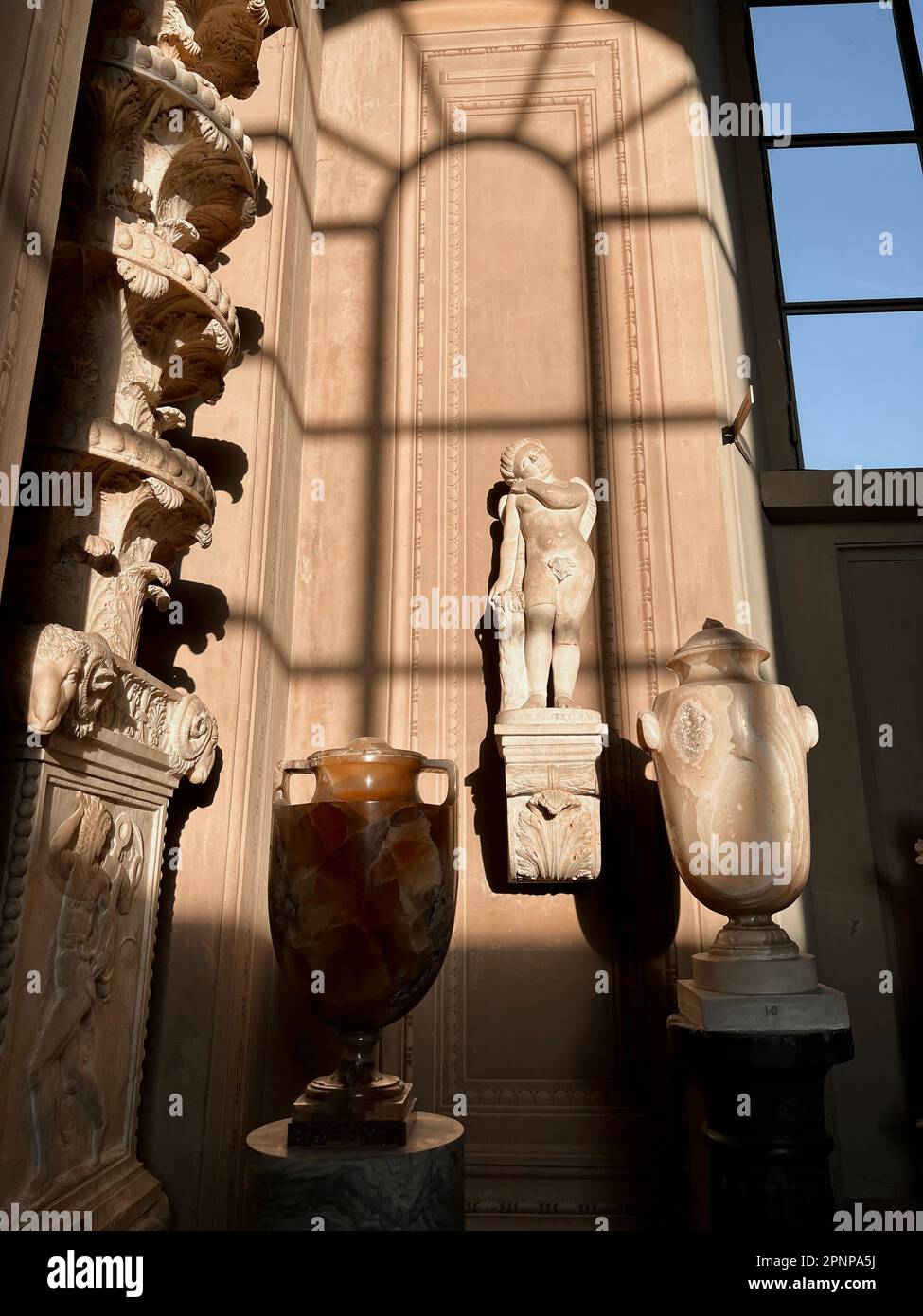 An image of a grand building featuring several statues and a large ...