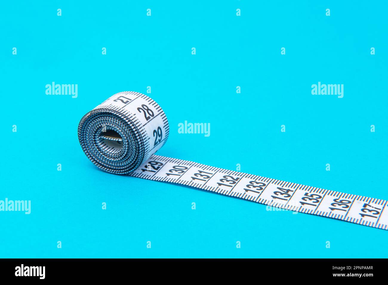 white tape measuring on a blue background with copyspace Stock Photo ...