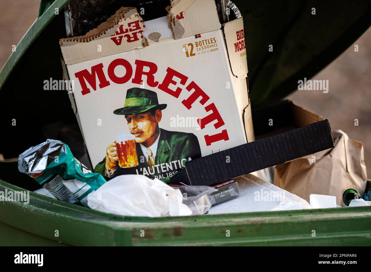 Moretti beer box in waste bin Stock Photo - Alamy
