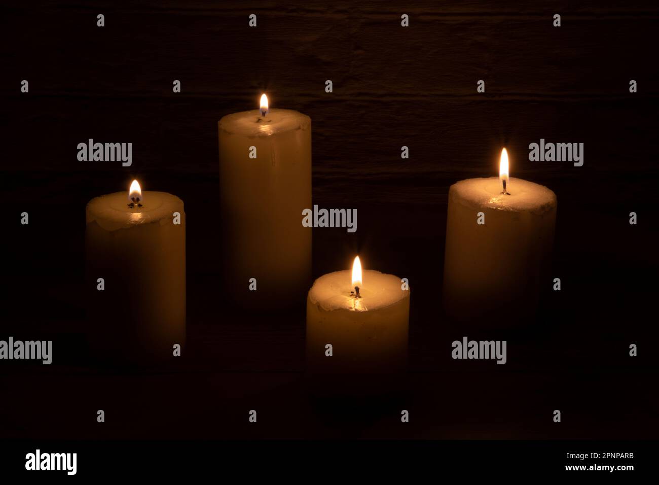 photo of a candle and the flame from a burning candle Stock Photo - Alamy