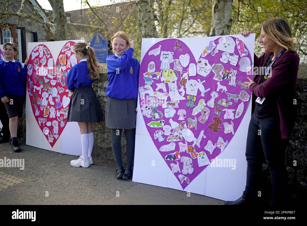 Pupils and teachers from Aldington Primary School pay their respects to ...