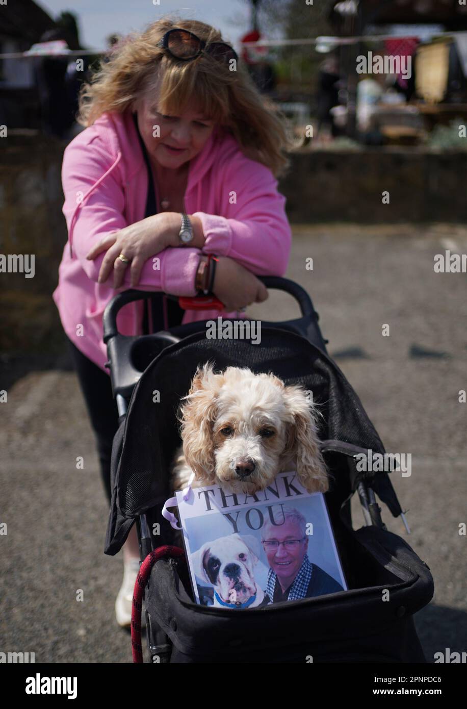 A person waits outside the Walnut Tree Pub in Aldington, Kent, ahead of ...