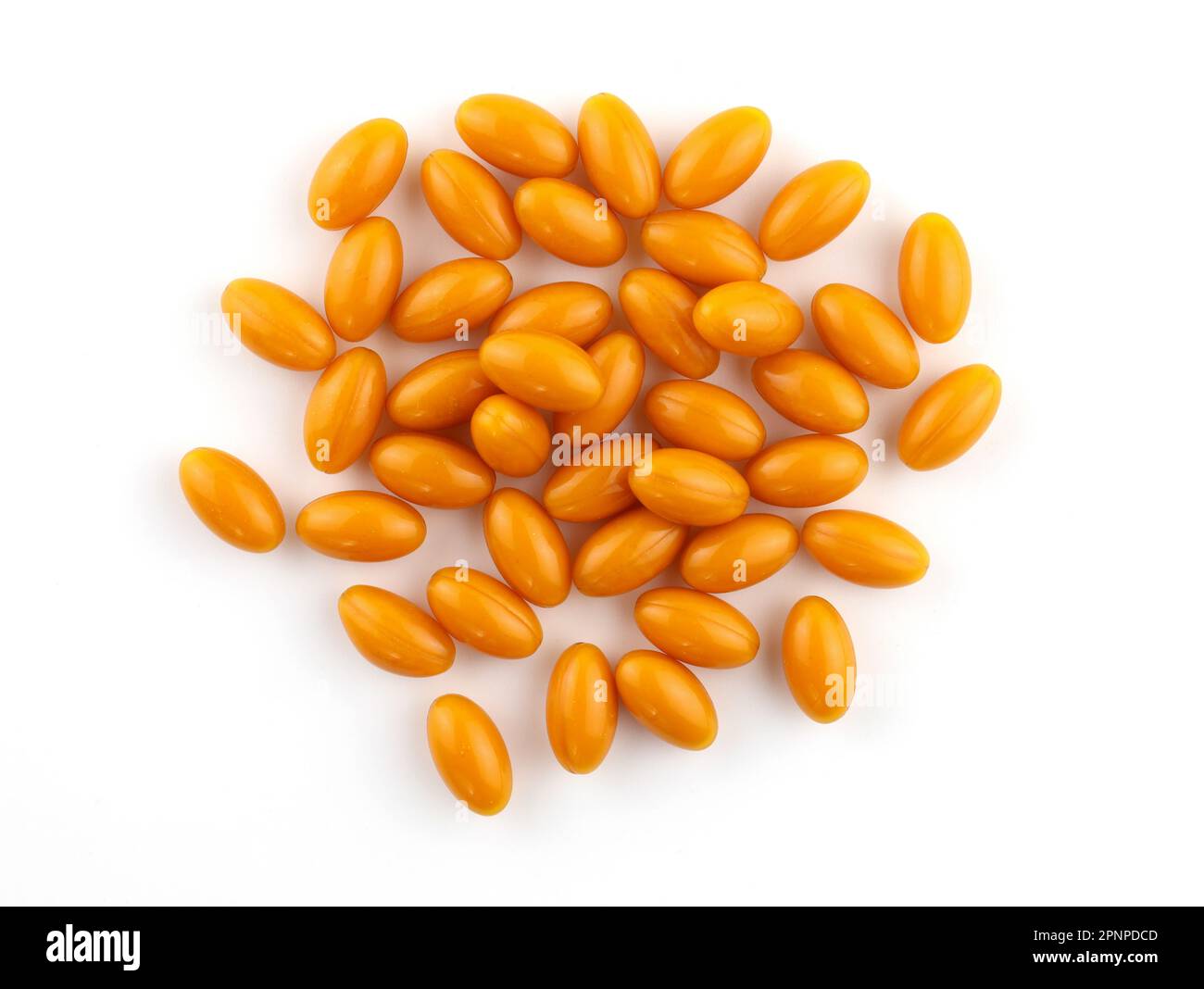 Oval orange capsules on a white background. Capsules in gelatin shell ...