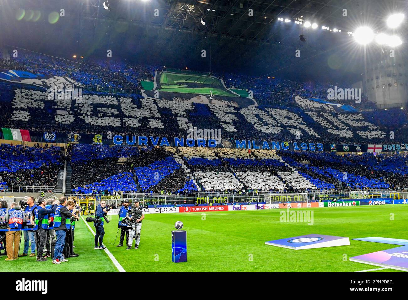 Milano, Italy. 19th Apr, 2023. Football fans of Inter seen on the stands with a huge tifo before ...
