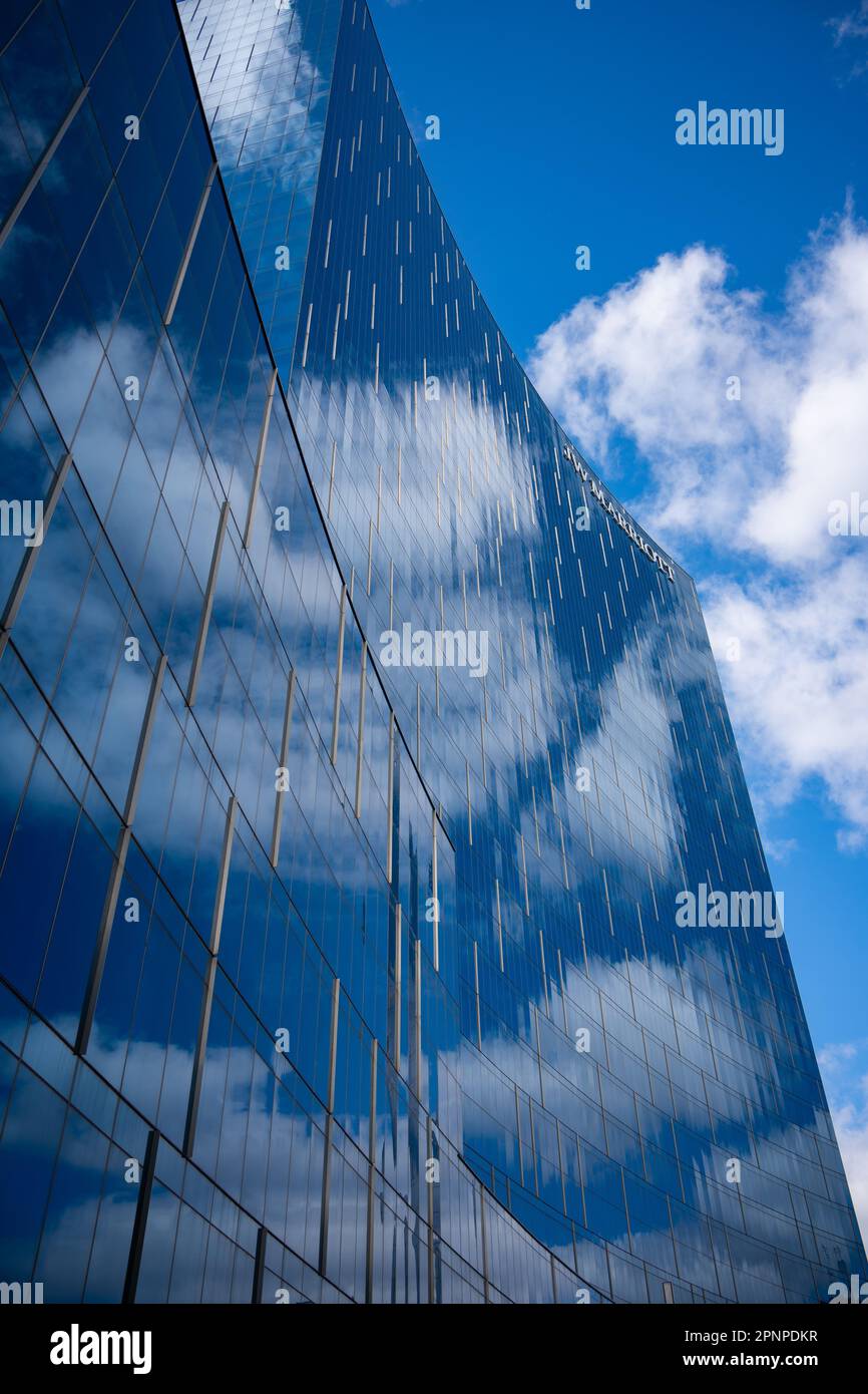 A modern architectural structure featuring reflective windows which ...