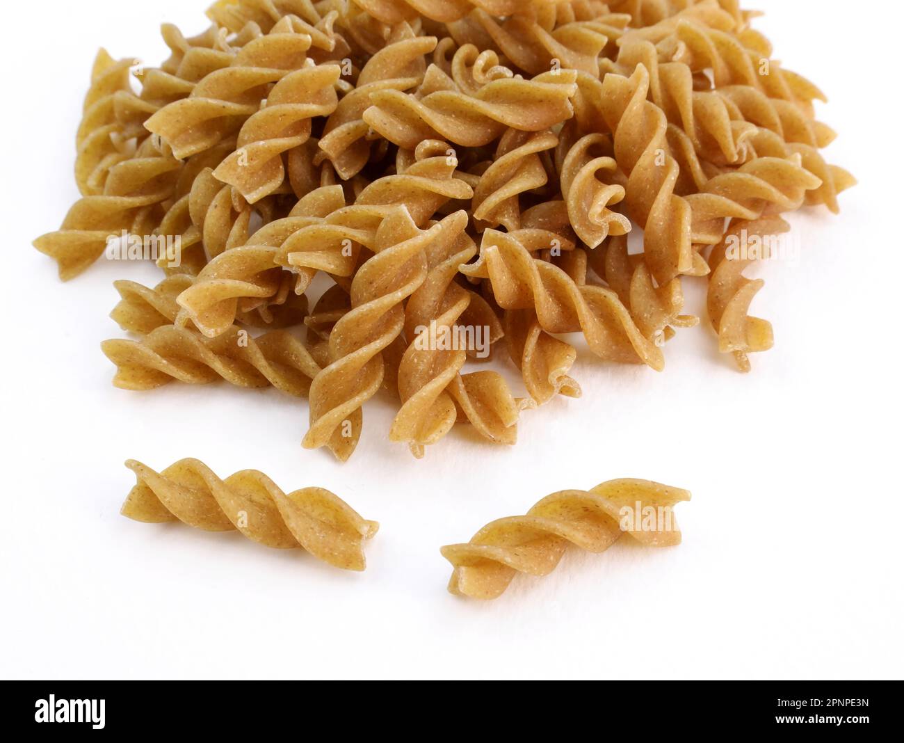 Heap of raw dry eggless rye fusilli. Organic wholemeal rye spiral pasta ...