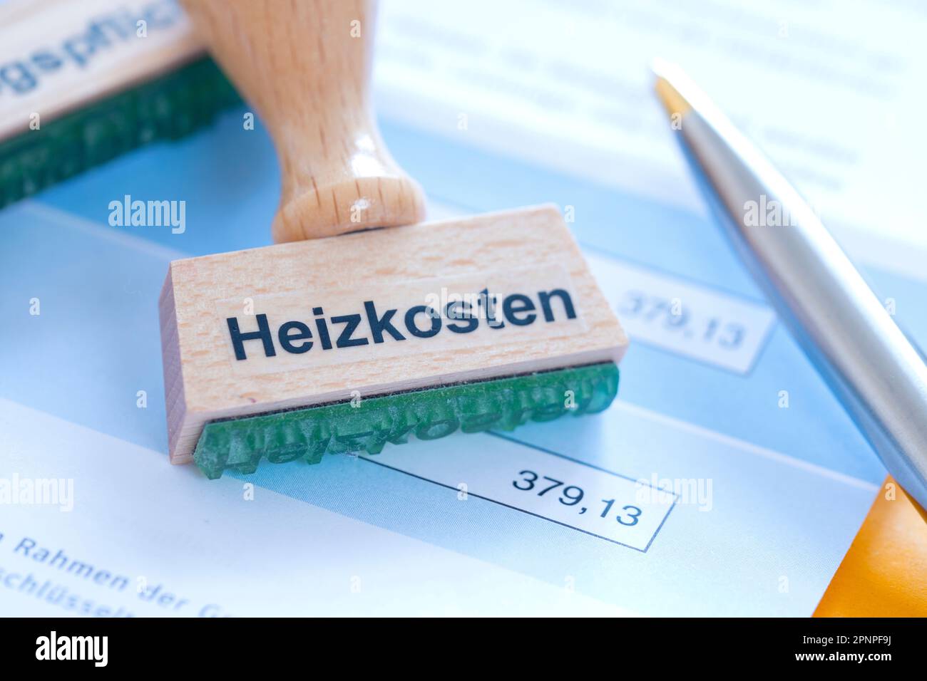 Stamp with heating costs inscription hi-res stock photography and images - Alamy