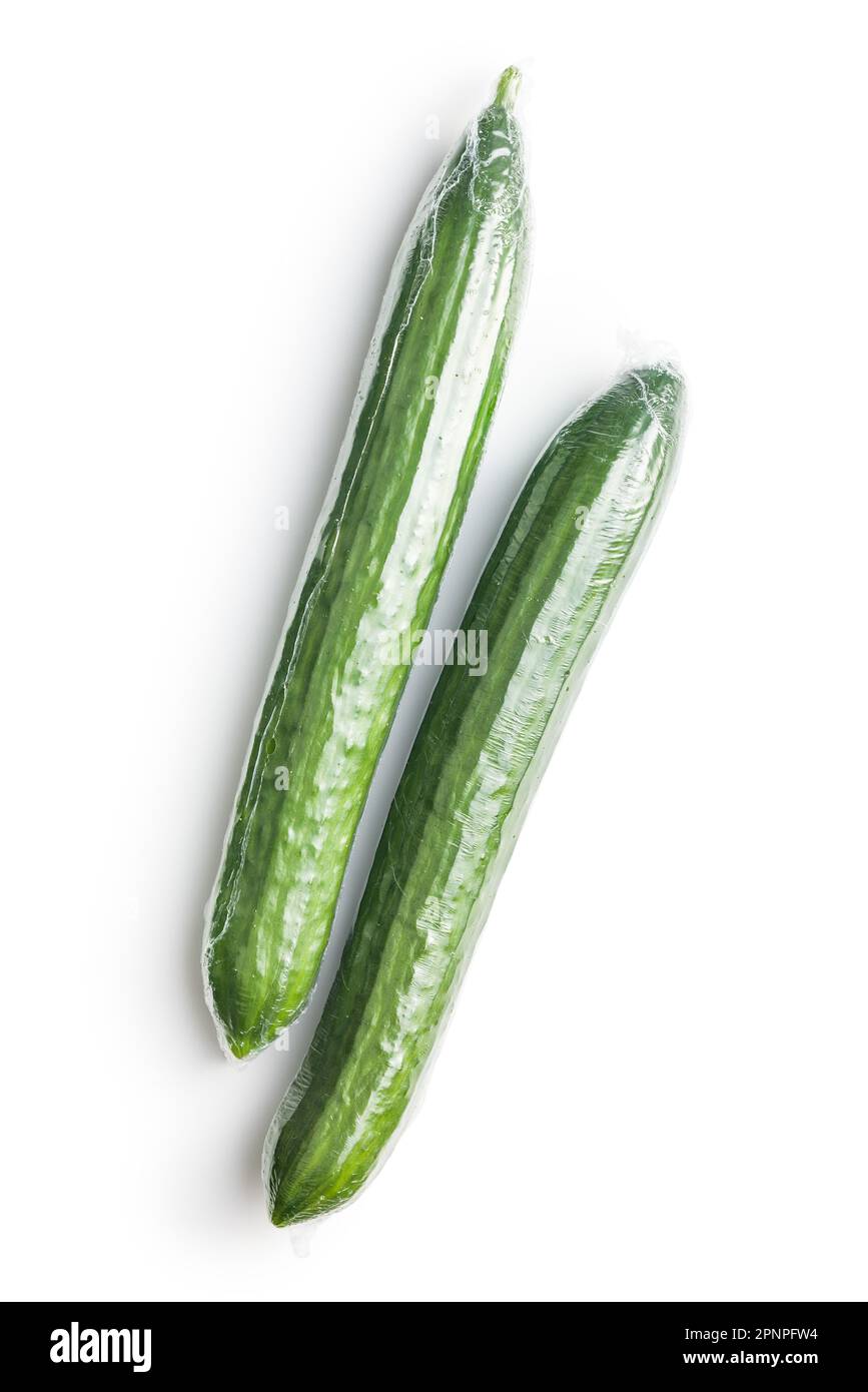Fresh green cucumbers wrapped in plastic wrap isolated on the white ...