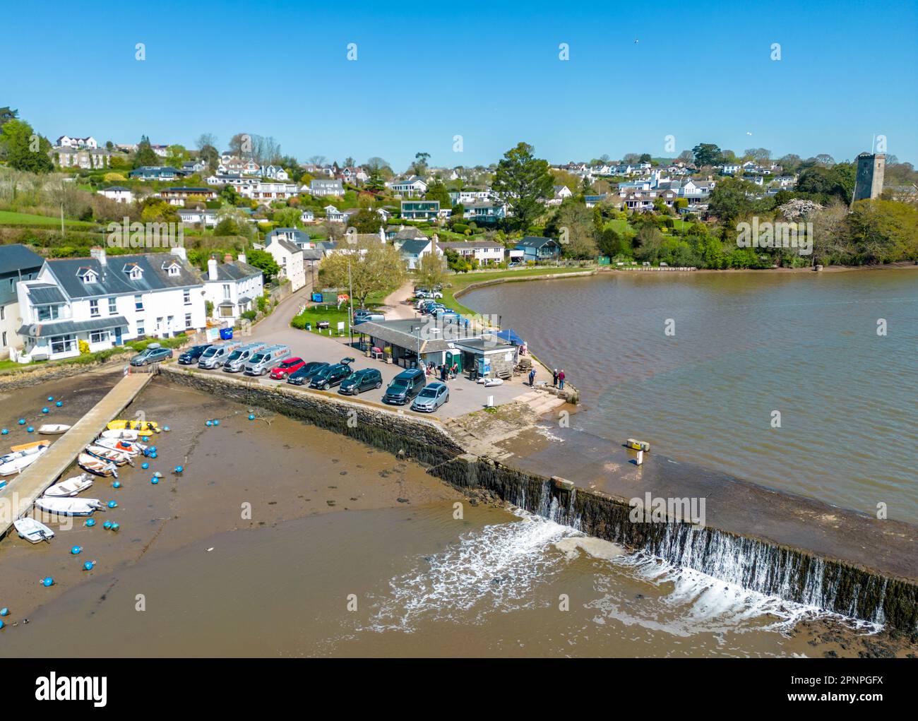 Totnes, UK. 20th Apr, 2023. Water flows over the Mill Pond weir at ...