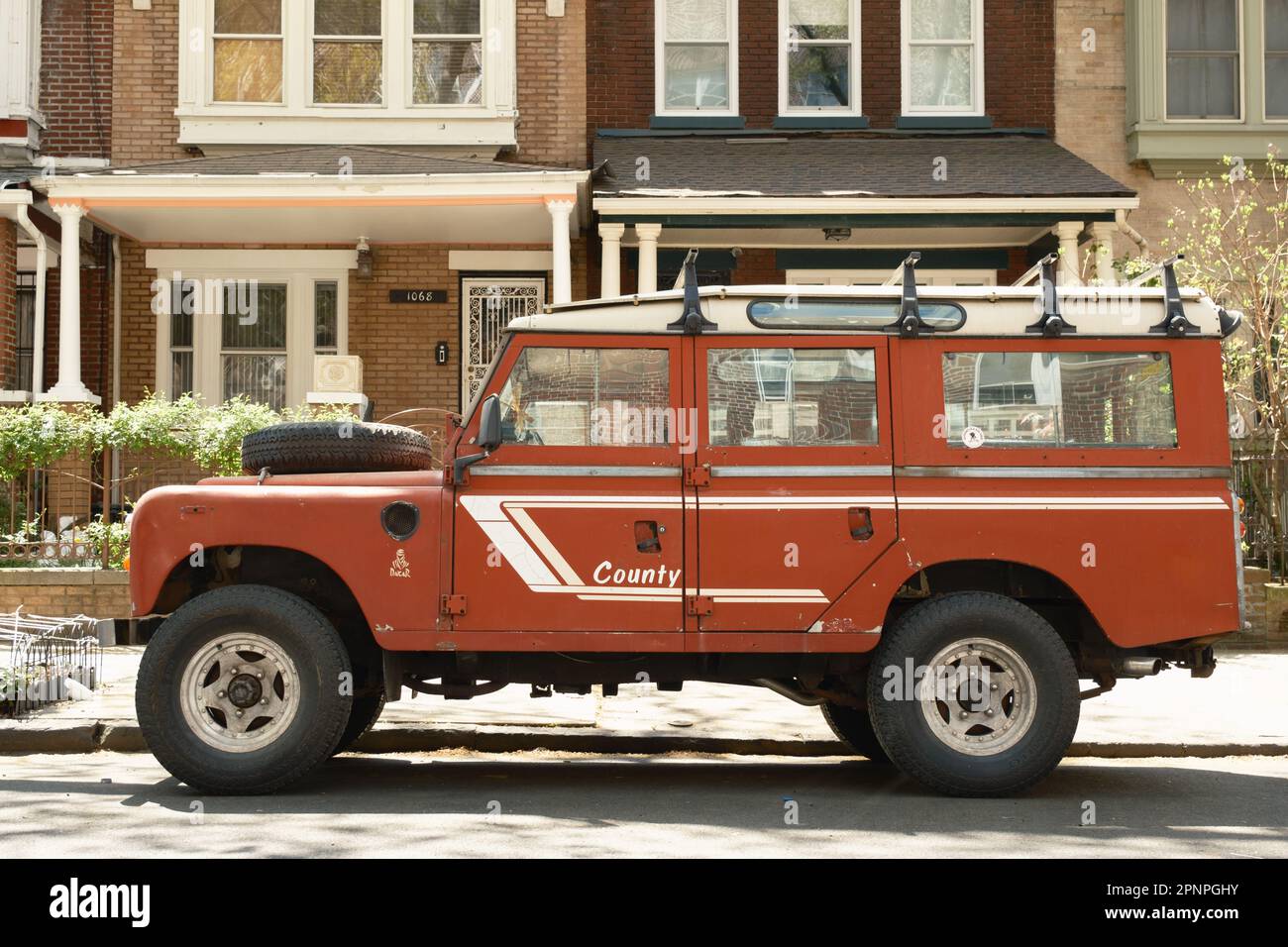 A red Land Rover Defender, in Crown Heights, Brooklyn, New York Stock ...