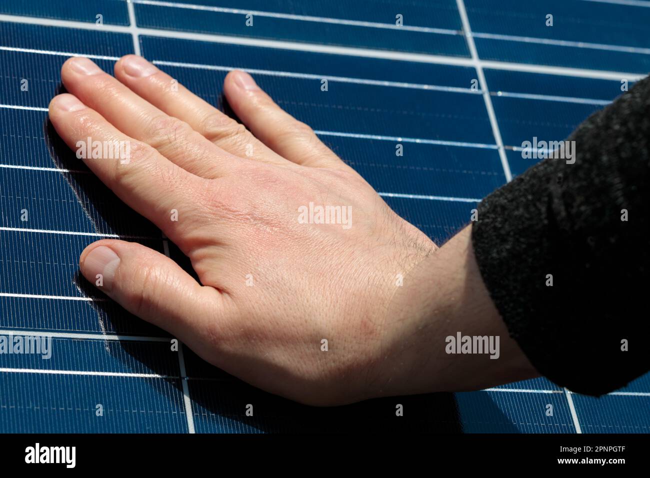 Solar panel cells close up and hand. - alternative energy Stock Photo ...