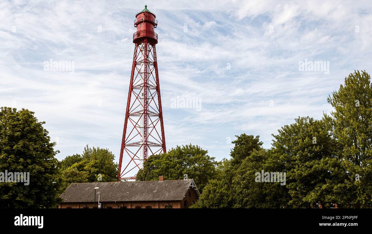 The cloudy sky over Campen Lighthouse, highest lighthouse in Germany ...