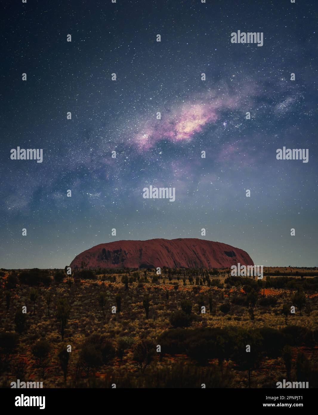 ayers Rock Uluru by night with milky way, stars field and galaxies ...
