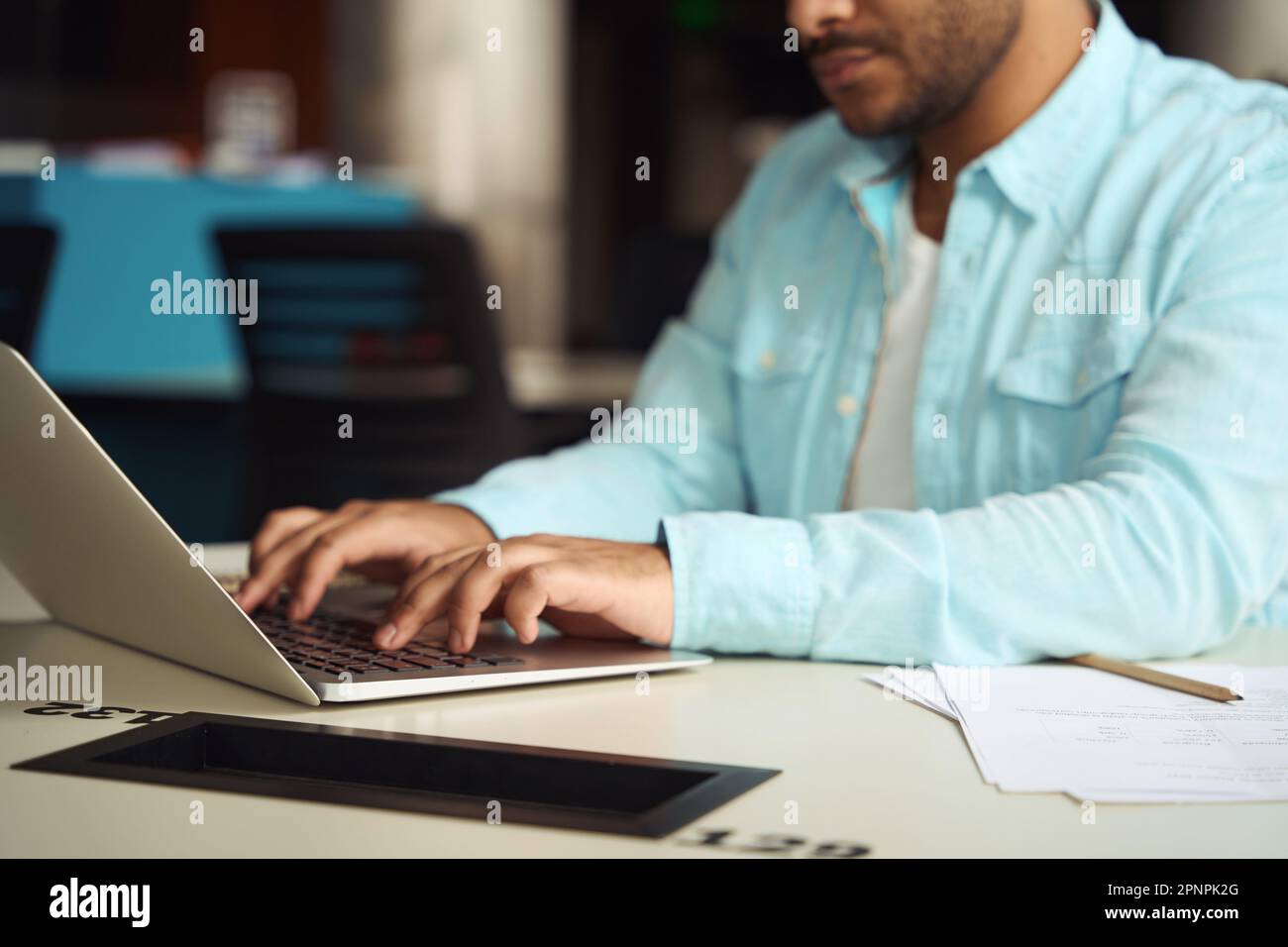 Close up photo of man entering data into computer Stock Photo - Alamy