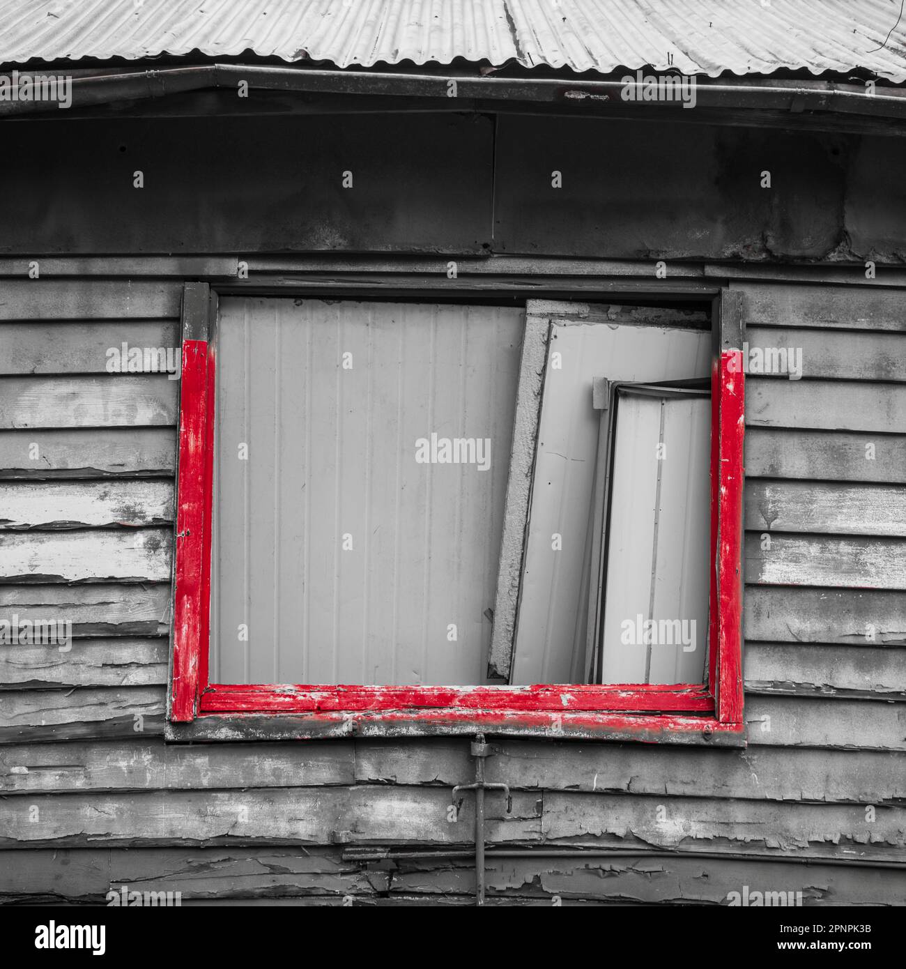 An abandoned timber house in country Victoria with a red painted window ...
