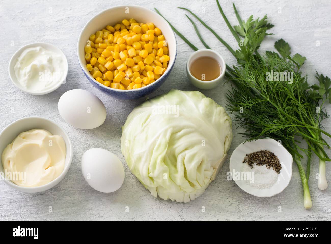Ingredients for cabbage salad with corn: white cabbage, corn, eggs ...