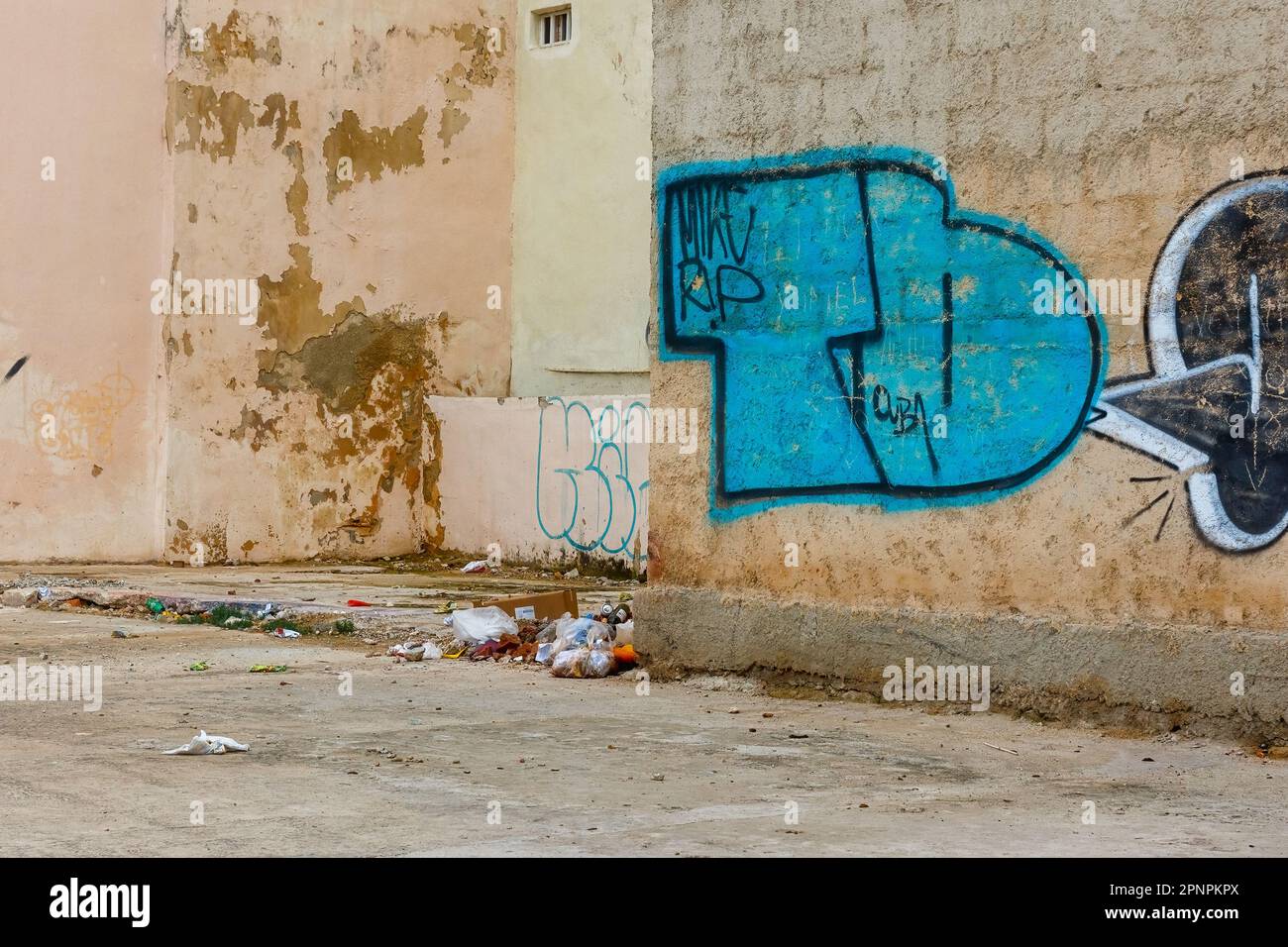 Havana, Cuba - April 12, 2023: Dirty street in the sidewalk with ...