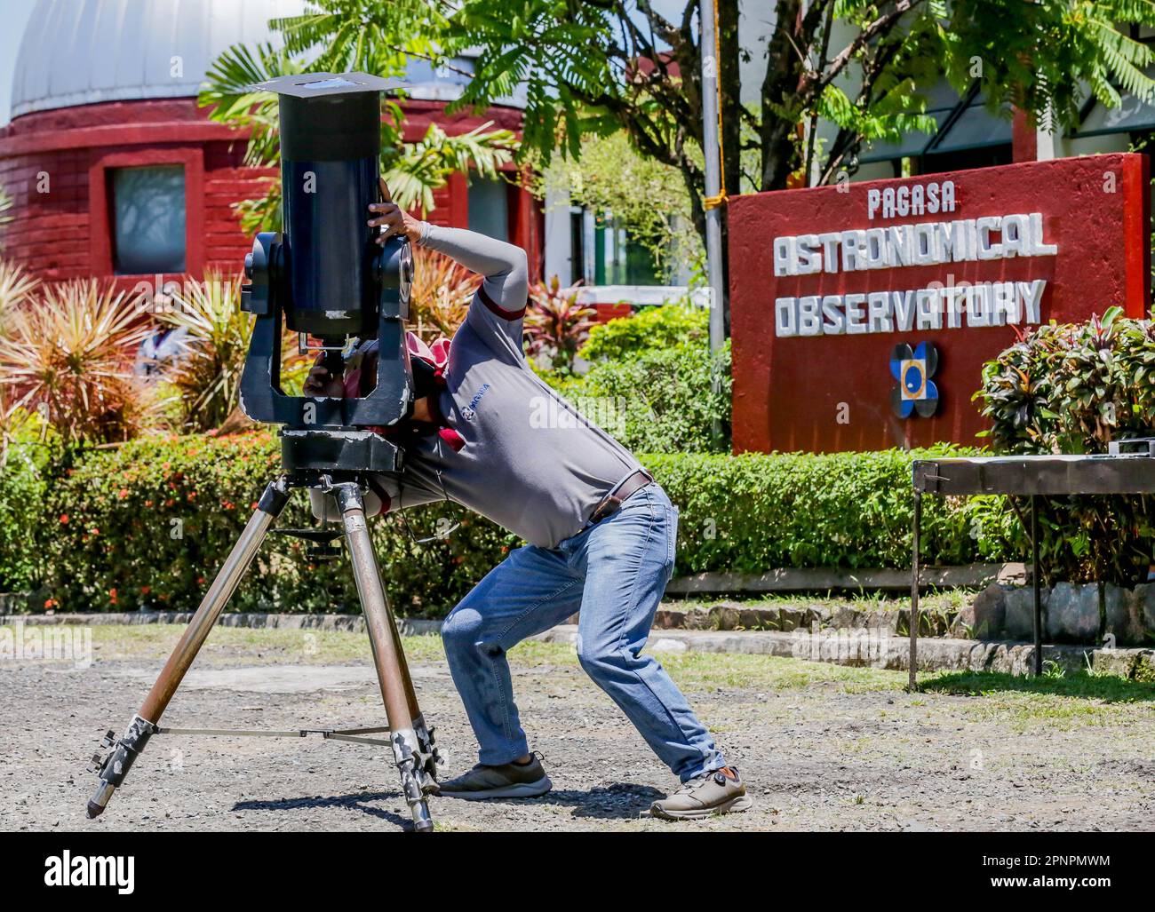 Quezon City, Philippines. 20th Apr, 2023. A man watches the partial ...