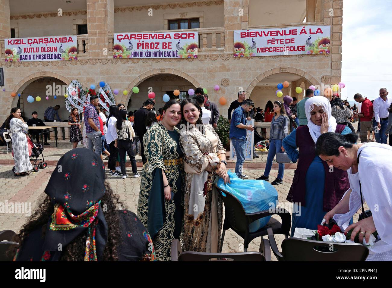 Kurdish, Turkish, German and French written banners greet guests at the ...