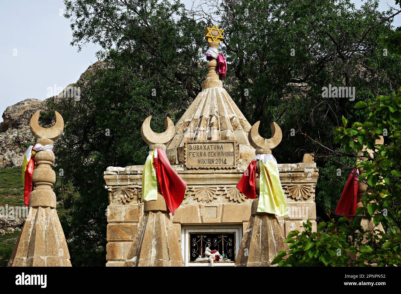 The moon symbols, known as sacred by the Yazidis, are seen at the ...