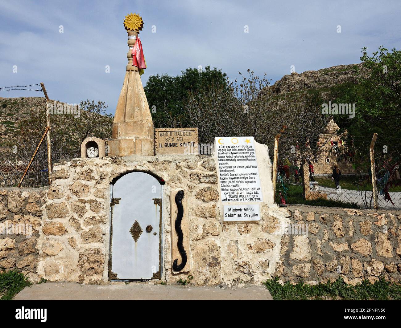 A Yazidi shrine in Kiwêxê village and the figure of a snake on its gate ...