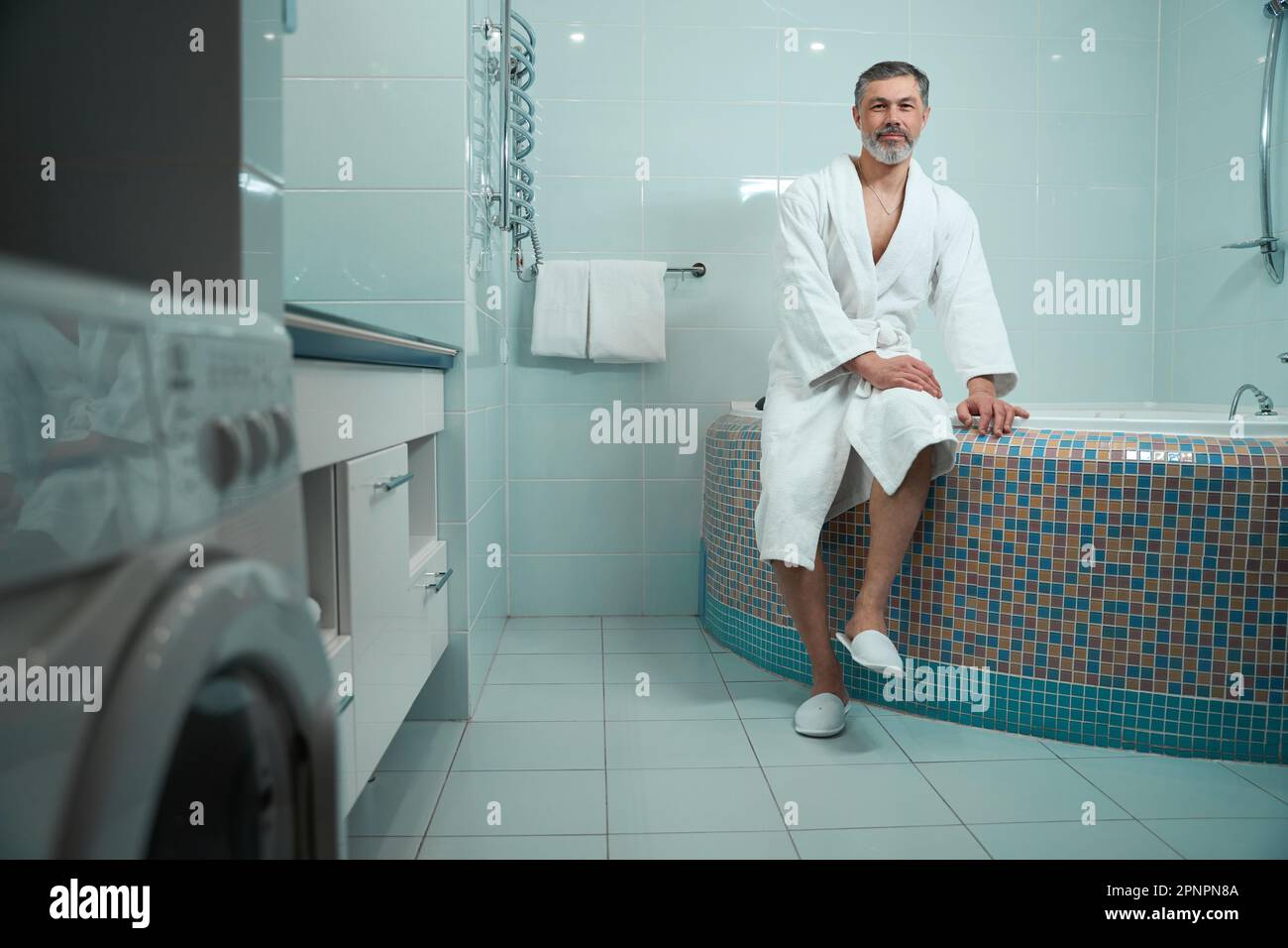 Man going into bathroom hi-res stock photography and images - Alamy