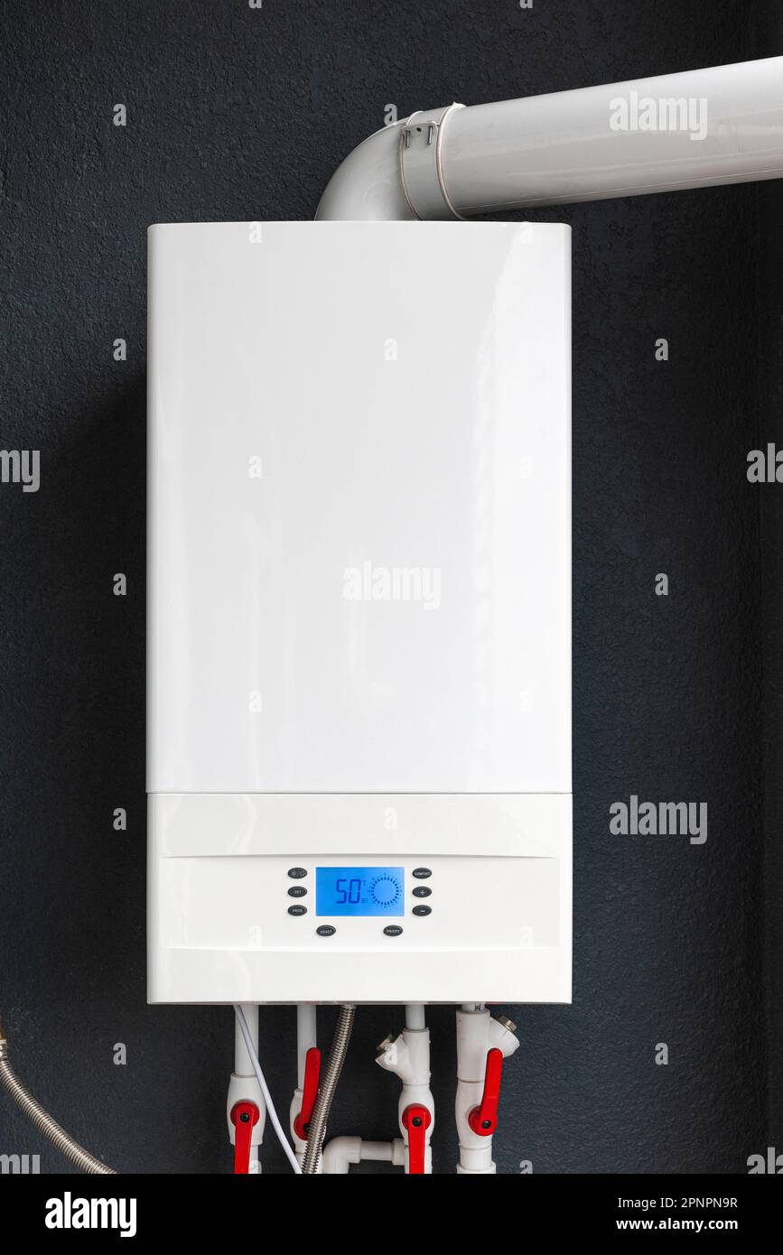 Gas boiler for winter home heating and water heating installed on the ...